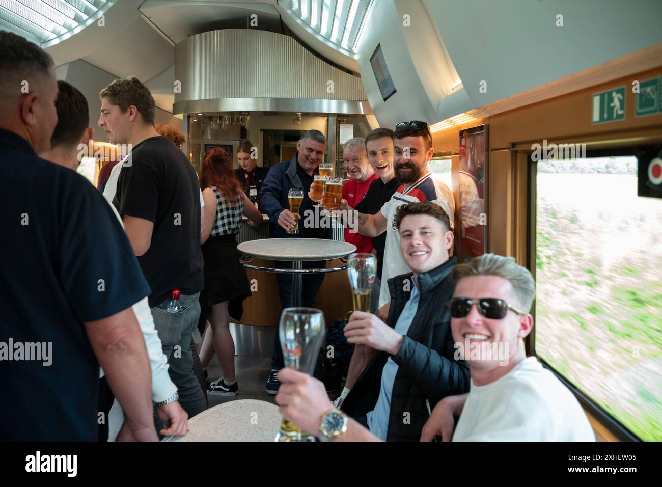 England fans and family members make their way to Berlin on the train ...