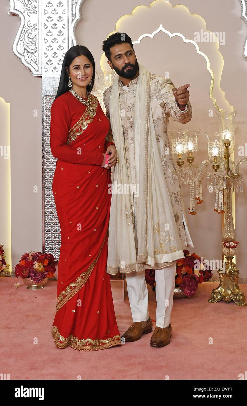 Mumbai, India. 12th July, 2024. Bollywood actor Vicky Kaushal pose for a photo with his wife and ...