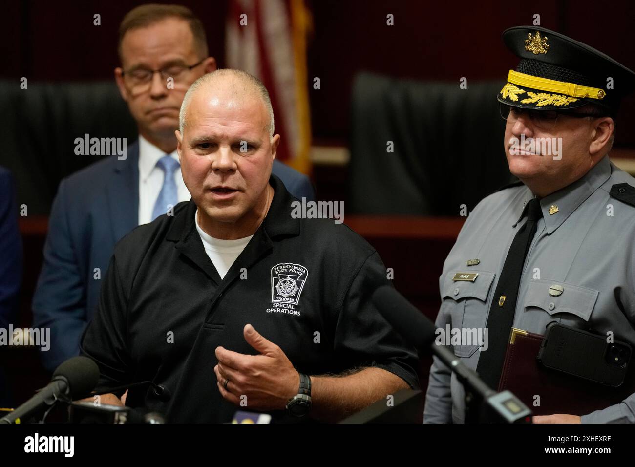 Lt. Col. George Givens, center, Pennsylvania State Police, answers ...