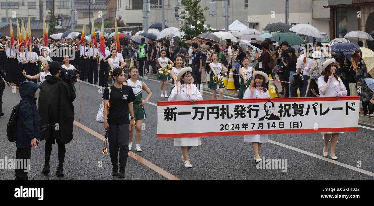 People participate in the parade to commemorate Eiichi Shibusawa, known as "the father of ...