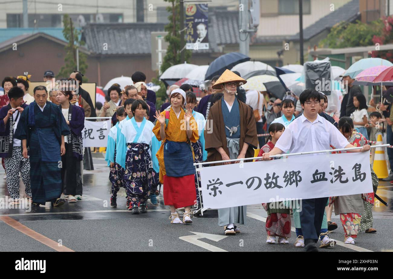 People participate in the parade to commemorate Eiichi Shibusawa, known ...
