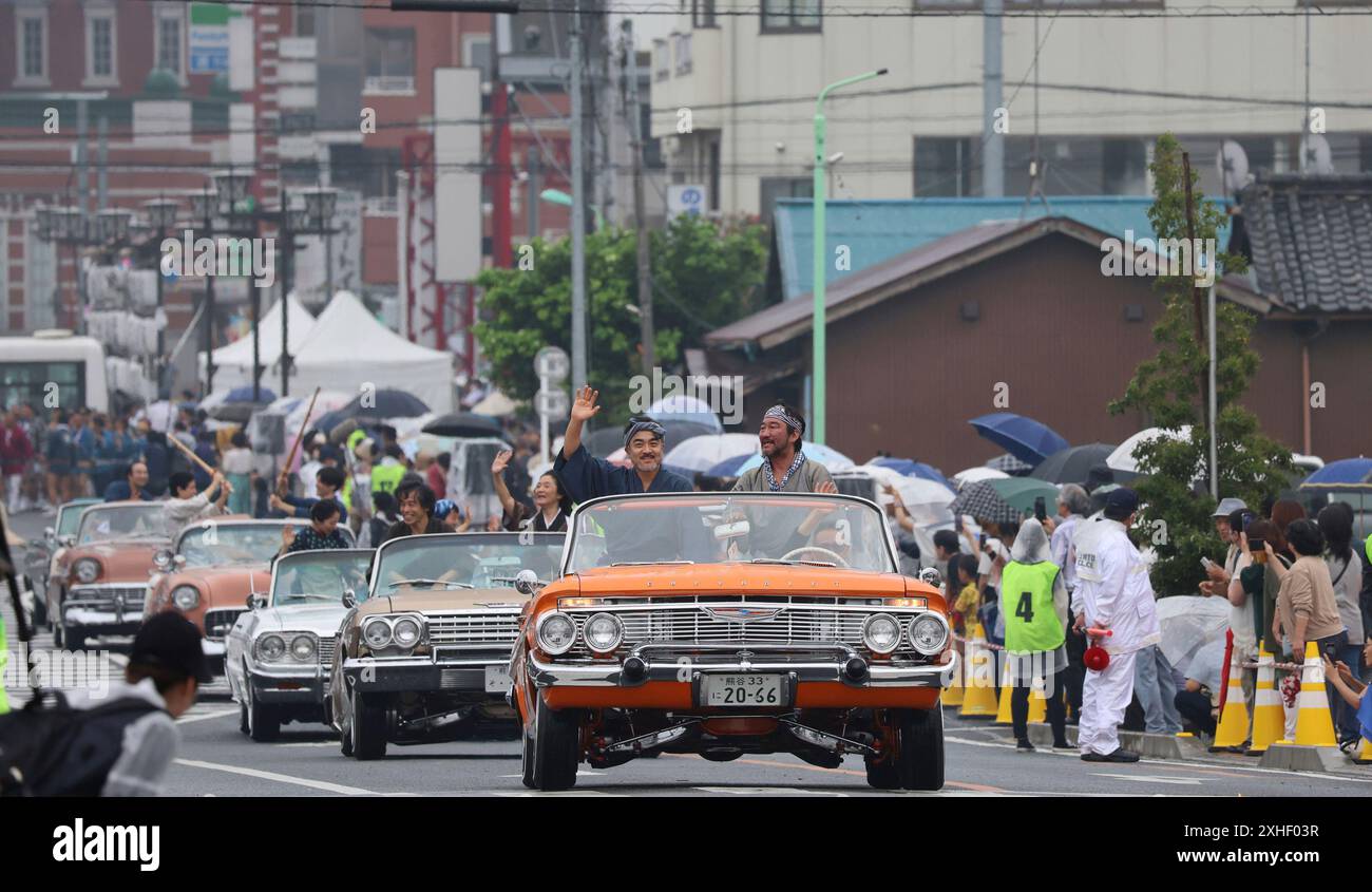 People participate in the parade to commemorate Eiichi Shibusawa, known ...