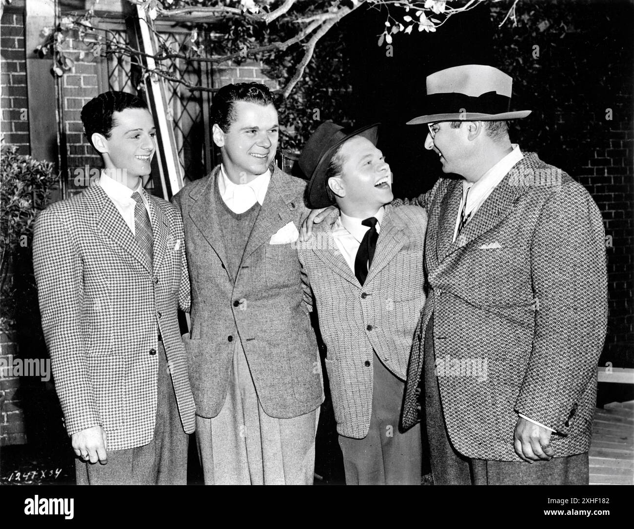 Set Visitor JACKIE COOPER (second left) visits FREDDIE BARTHOLOMEW ...