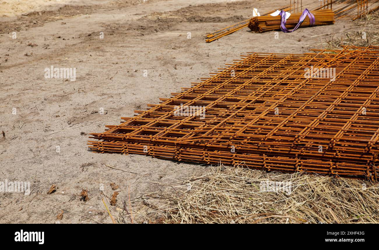 Reinforcing steel wire mesh laying on the ground of a construction site ...