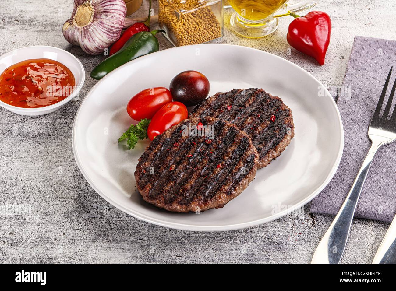 Grilled beef burger cutlet with sauce Stock Photo - Alamy
