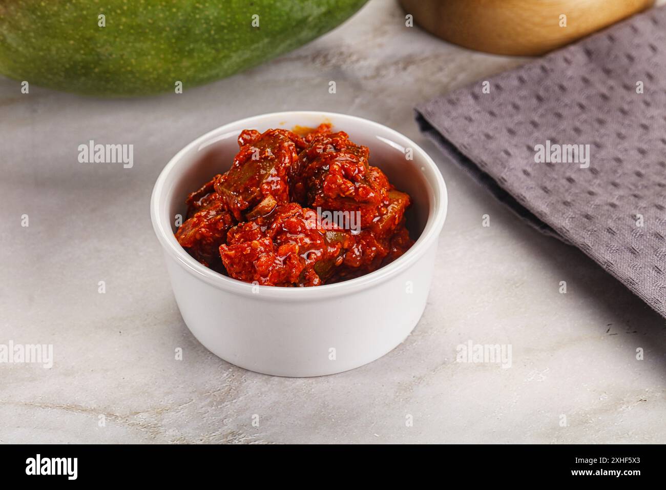 Indian cuisine Spicy pickled raw green mango Stock Photo - Alamy