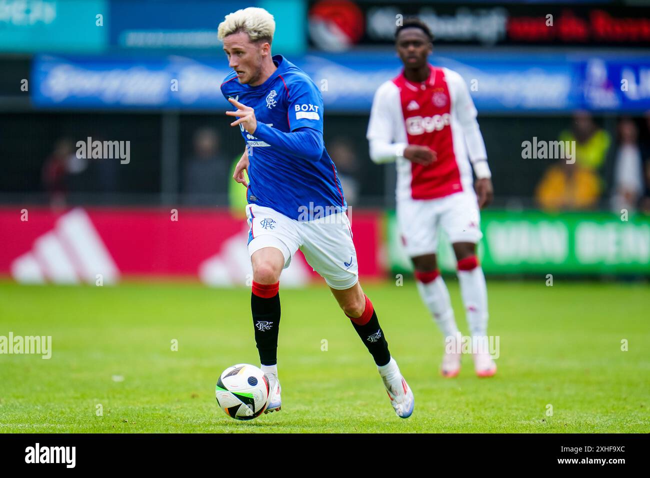 WEZEP, NETHERLANDS - JULY 13: Alex Lowry of Rangers FC dribbles with ...