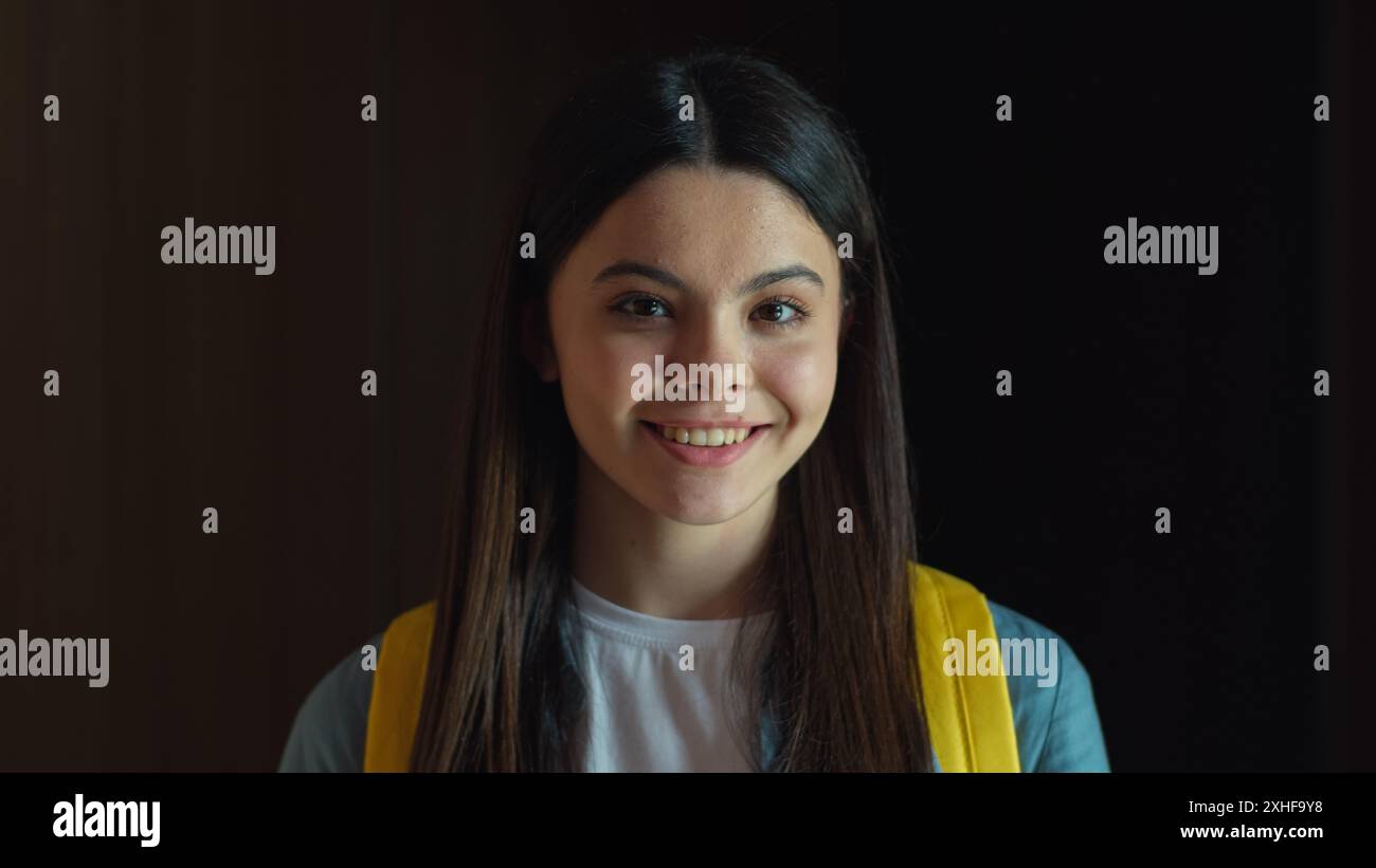 Portrait happy smiling positive toothy smile healthy Caucasian student girl female schoolgirl ...