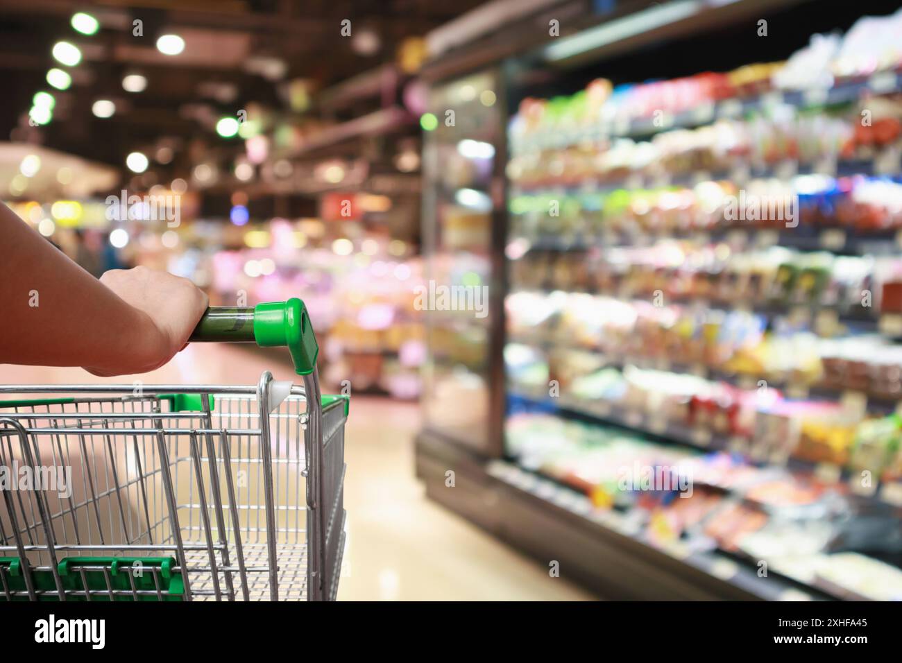 Blurred view of woman shopping aisle hi-res stock photography and ...