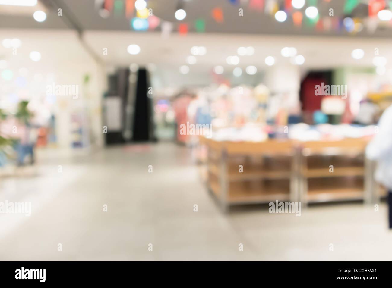 Abstract blur clothing boutique display interior of shopping mall ...