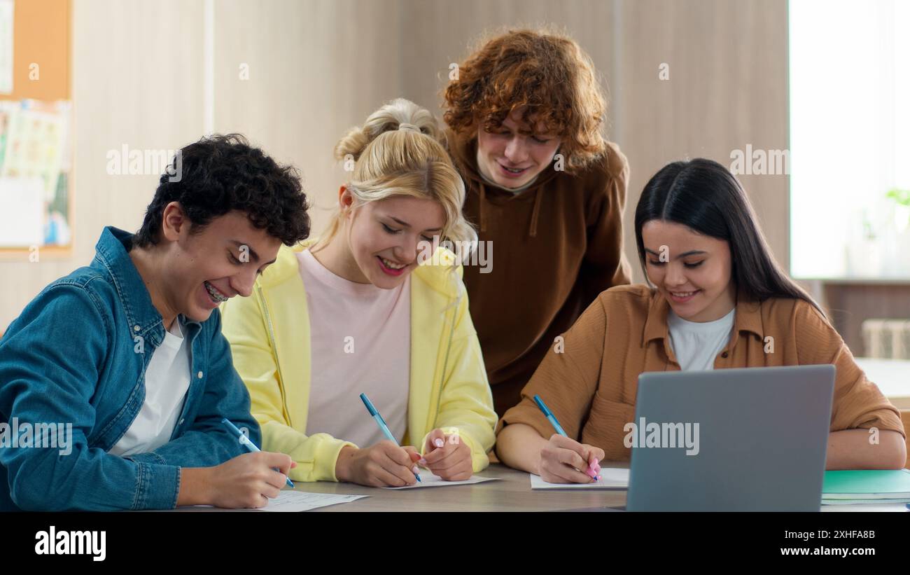 Happy smiling successful friends education school university writing ...