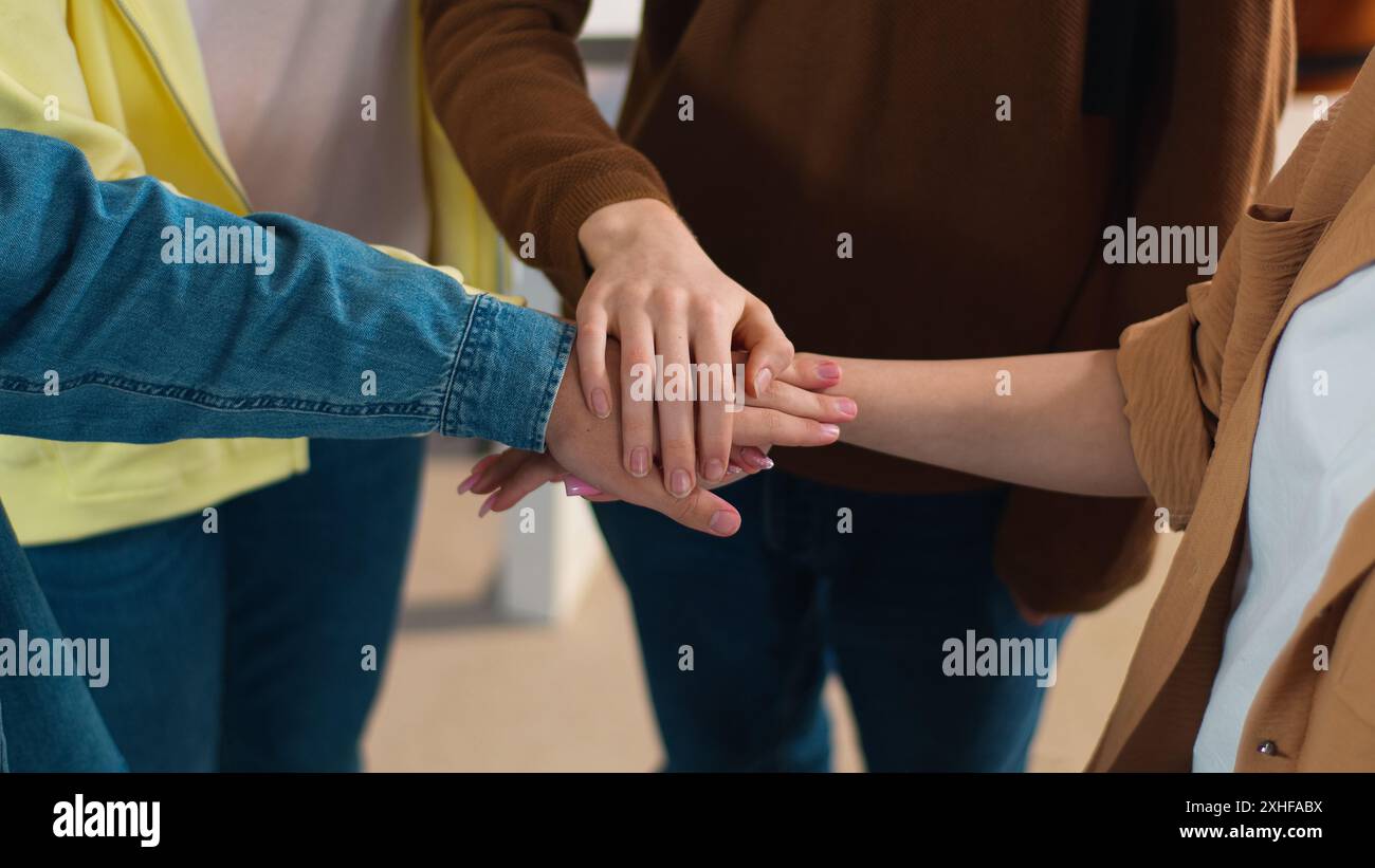 Cropped view many arms stack hands buddies cooperation unity teamwork ...