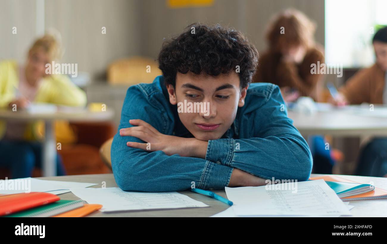 Tired sleepy napping exhausted fatigued overworked overload pupil teen ...