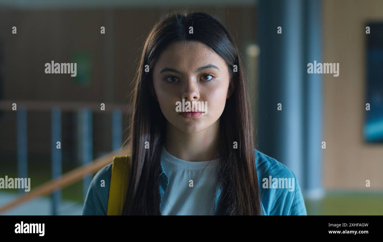 Portrait serious calm sad upset Caucasian student girl female ...