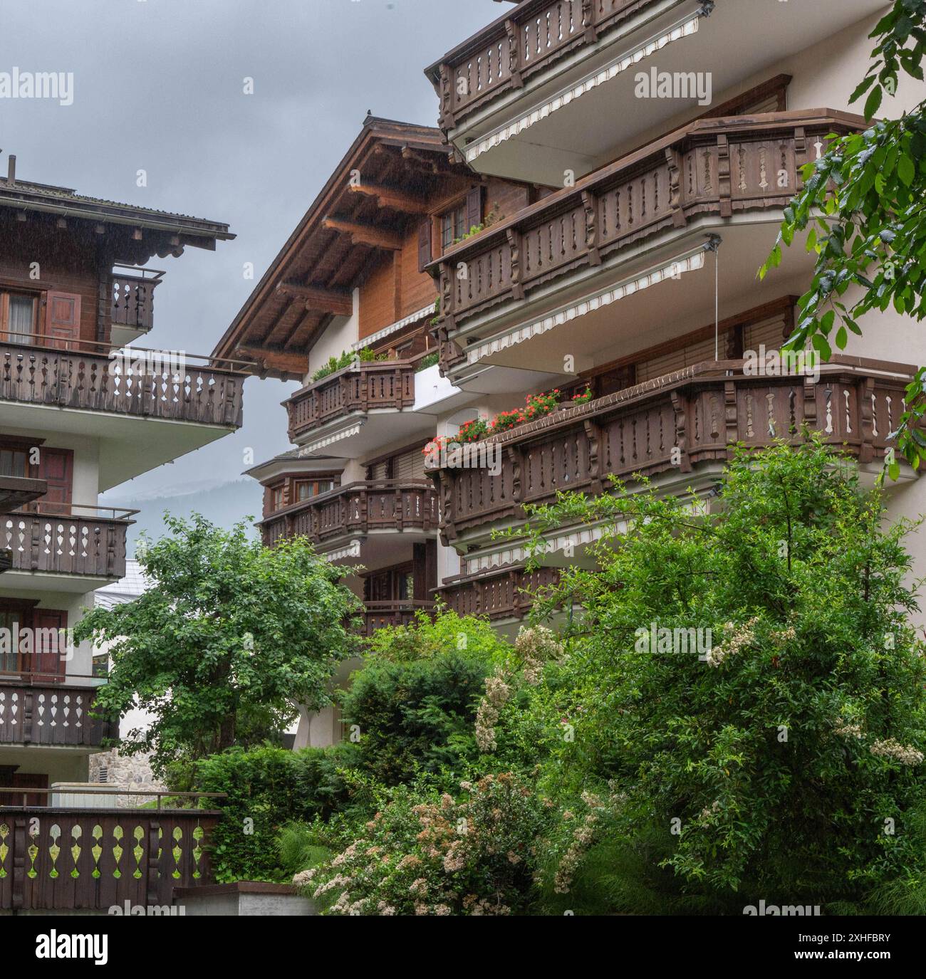 The traditional Swiss chalet-style buildings with wooden balconies ...