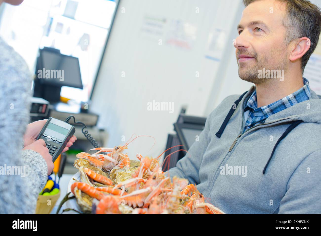 a fishmonger and a prawn platter Stock Photo - Alamy