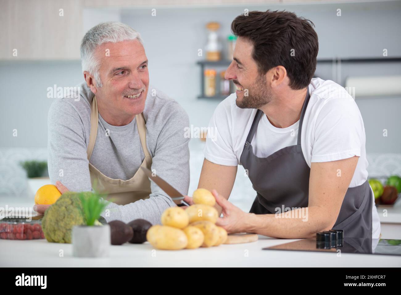 Father helping son prepare hi-res stock photography and images - Alamy