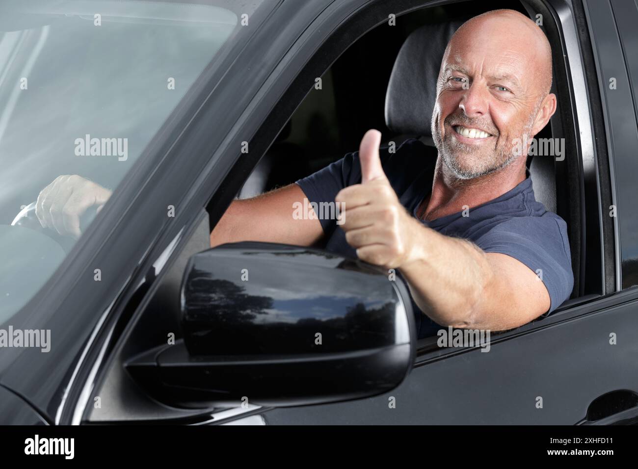 man in a car with thumbs up Stock Photo - Alamy