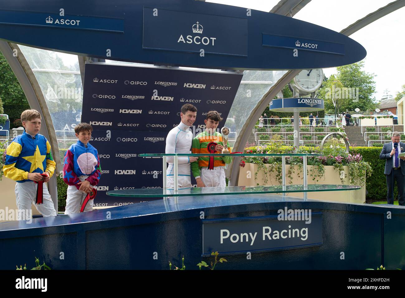 Ascot, Berkshire, UK. 13th July, 2024. Jockey Oisin Murphy presents a ...