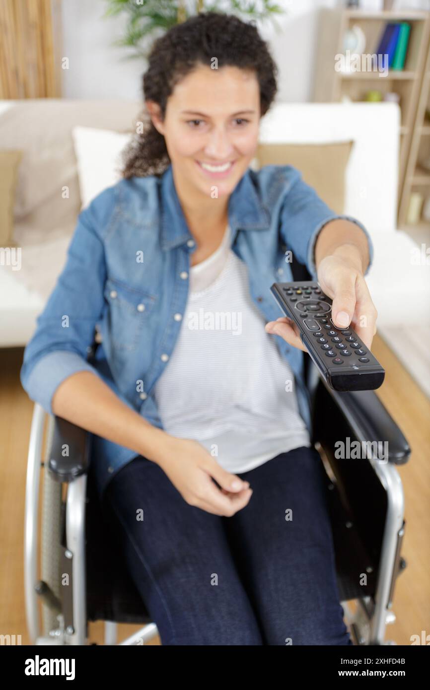 Pretty woman changing tv channel hi-res stock photography and images ...