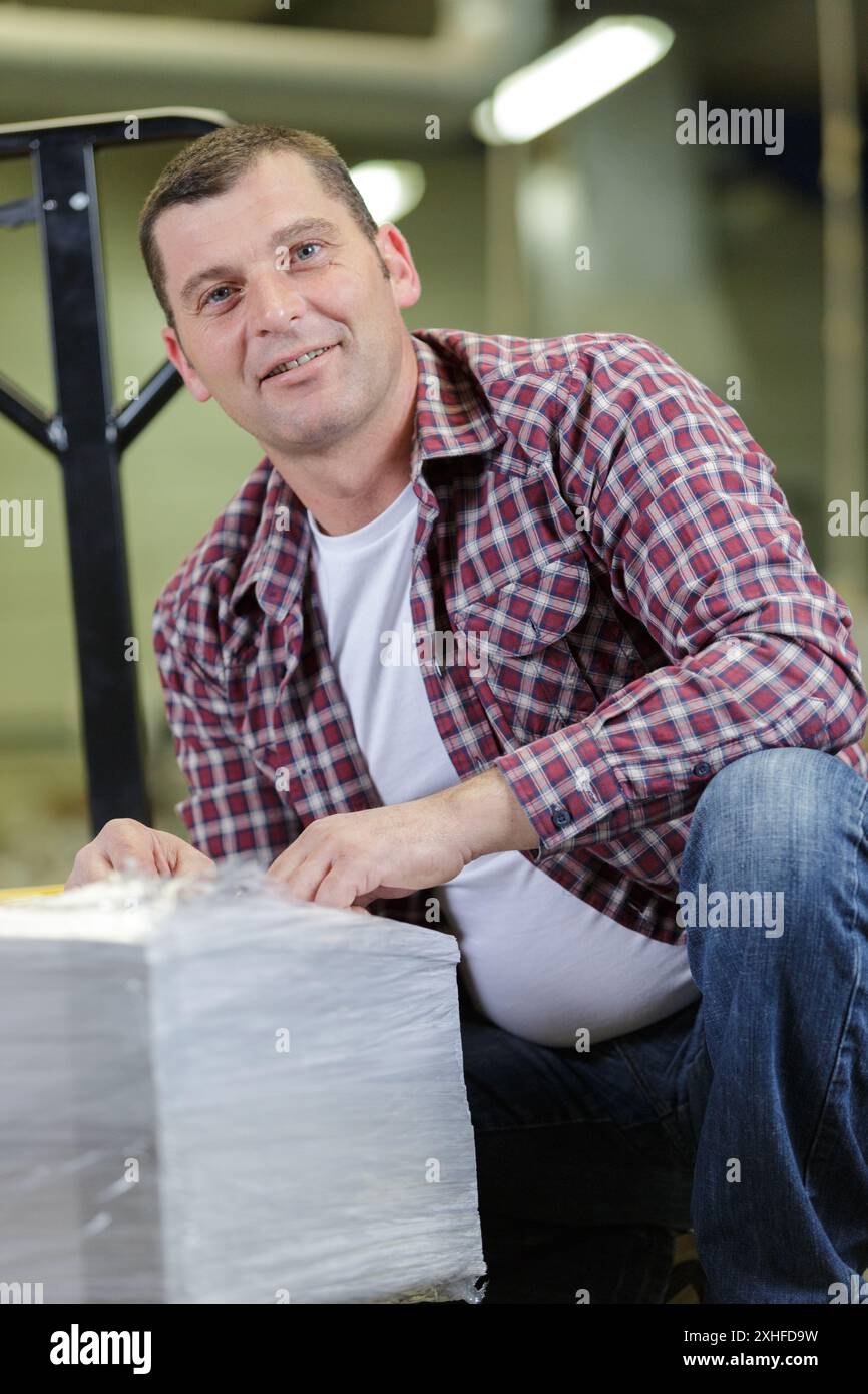 Construction worker performing manual hi-res stock photography and ...