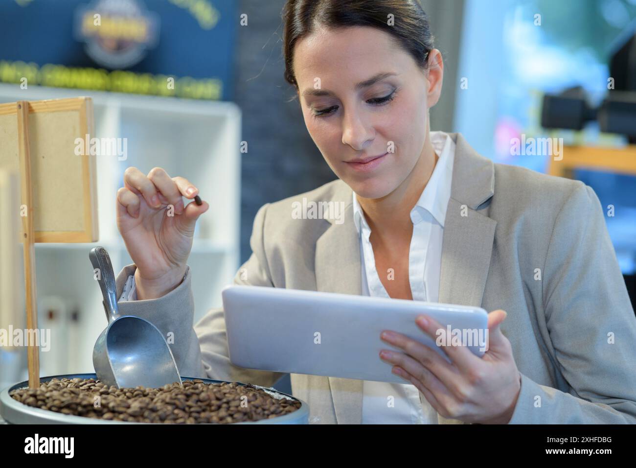 Young barista checking coffee hi-res stock photography and images - Alamy