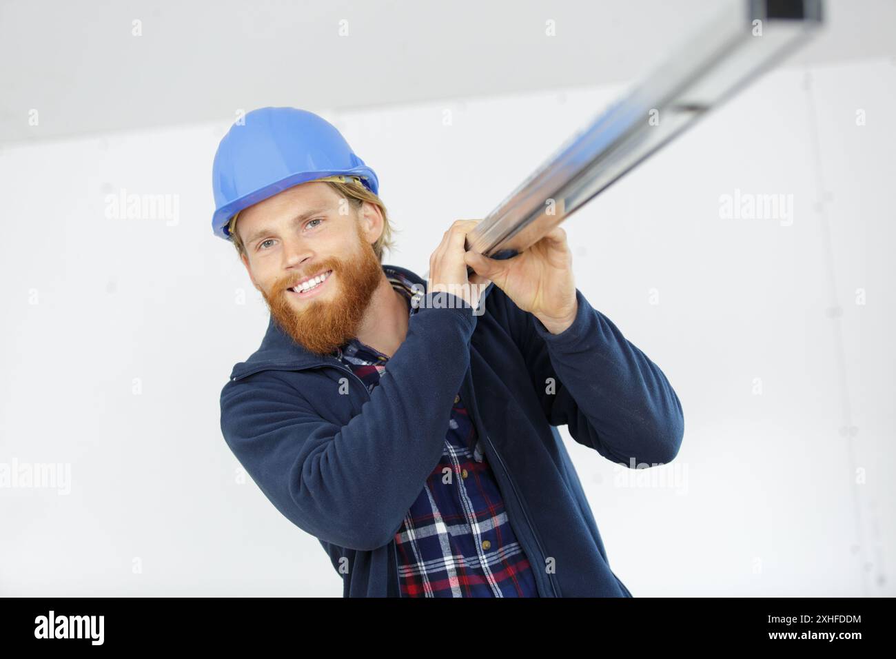 Man carrying construction supplies hi-res stock photography and images ...