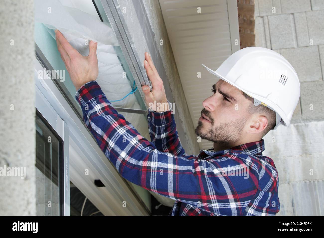 Repairman installing curtains hi-res stock photography and images - Alamy