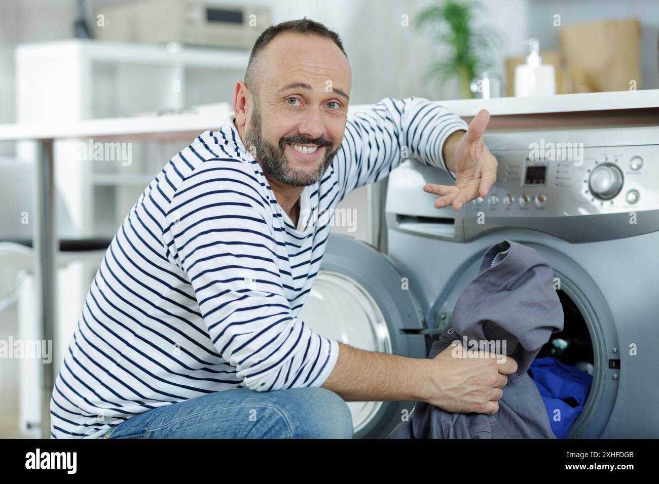 Funny young man washing hi-res stock photography and images - Alamy