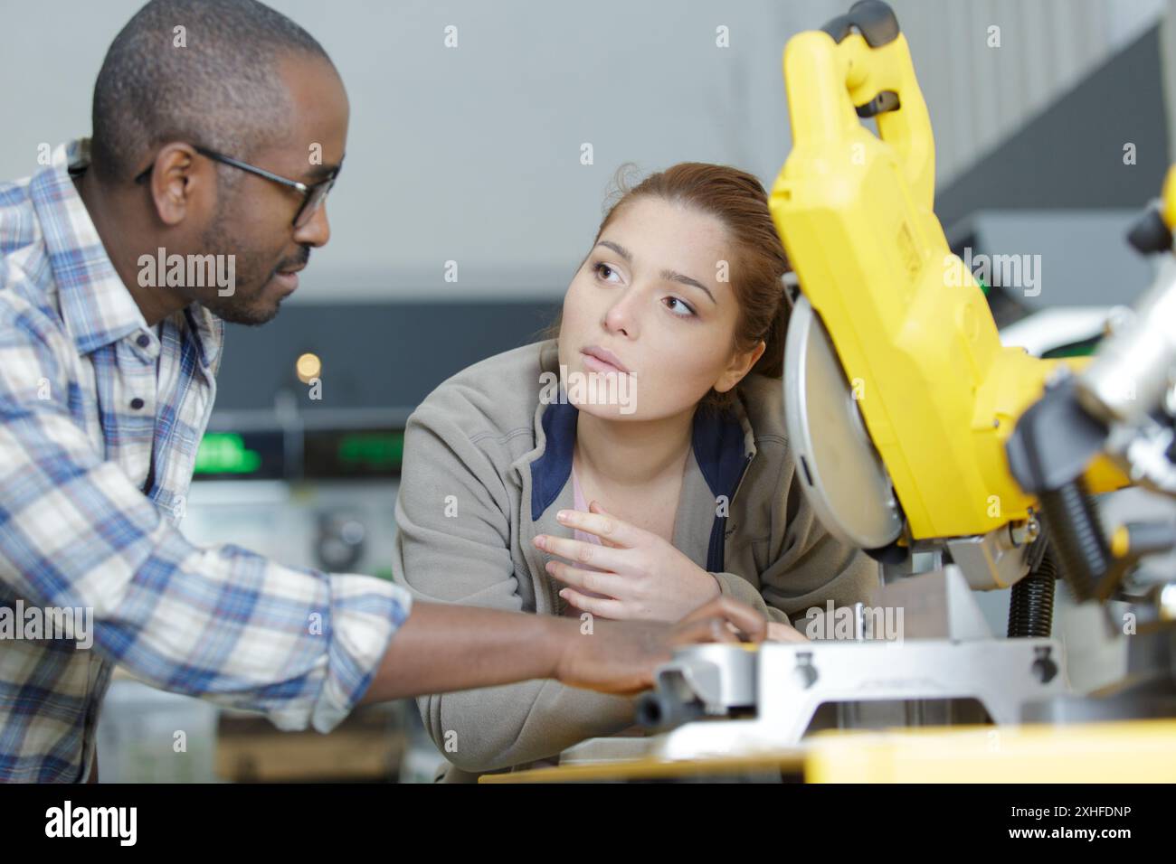female apprentice learning to use a circular saw Stock Photo - Alamy