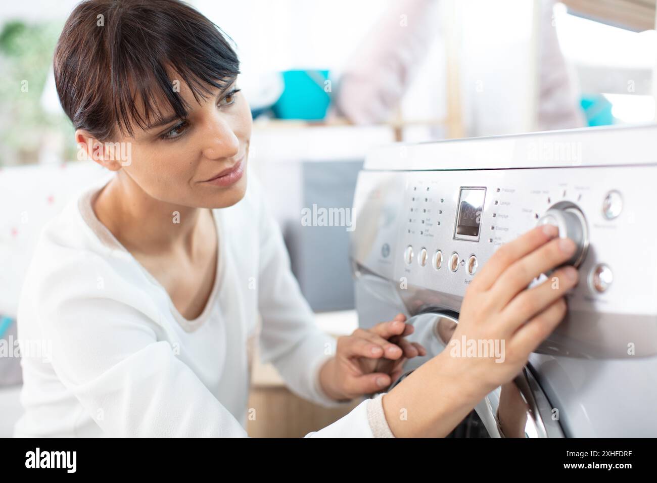 Clothes turning in washing machine hi-res stock photography and images ...