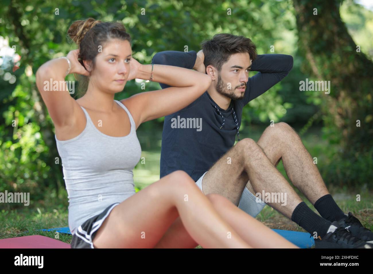 Sportive woman abdominal exercises outdoors hi-res stock photography ...