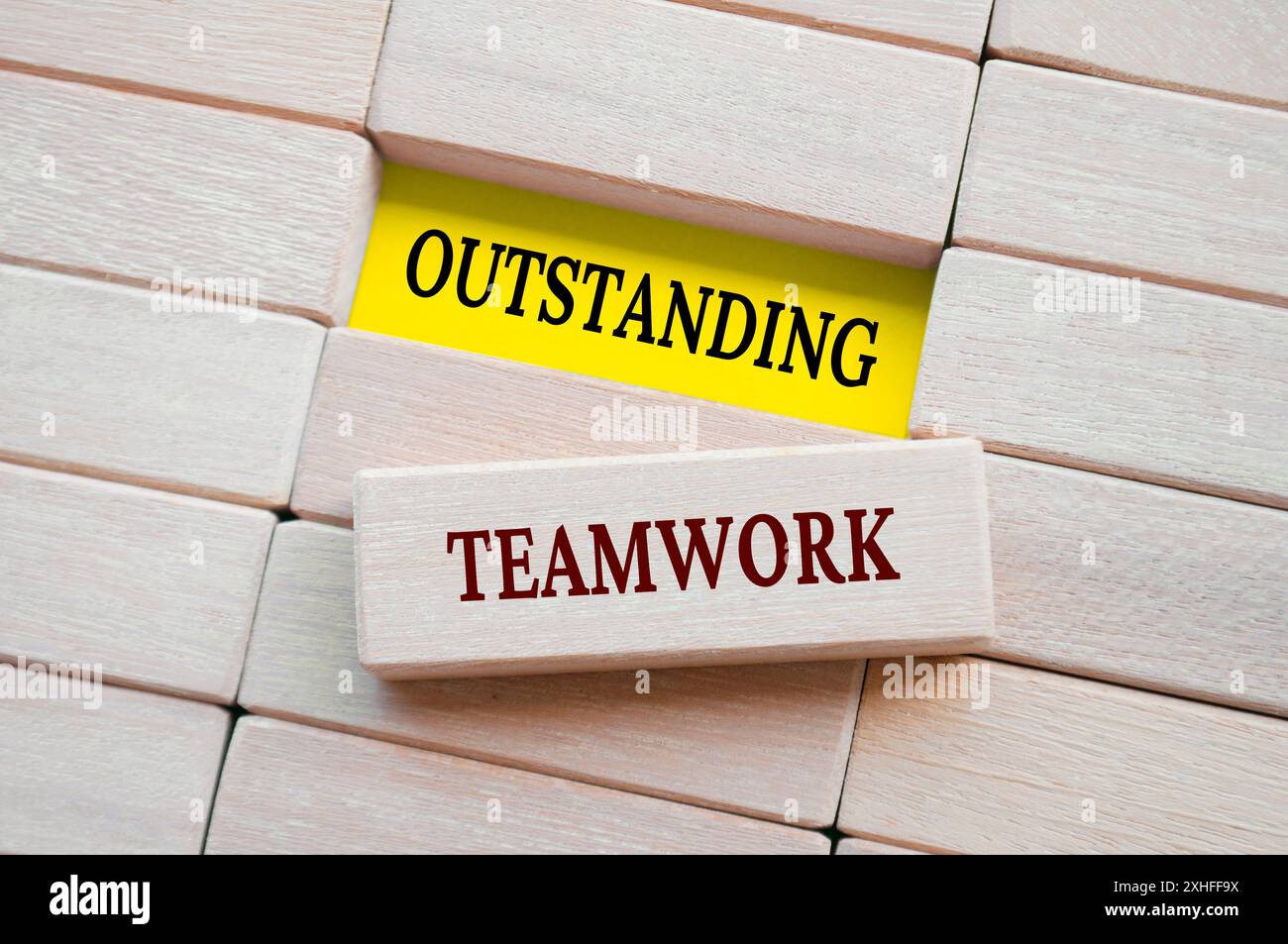 Top view of Outstanding Teamwork text on wooden blocks. Teamwork and ...