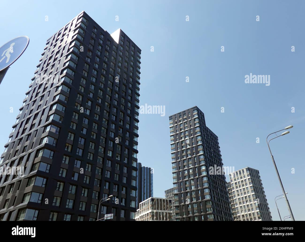 View to built high modern city apartment buildings with many windows in ...