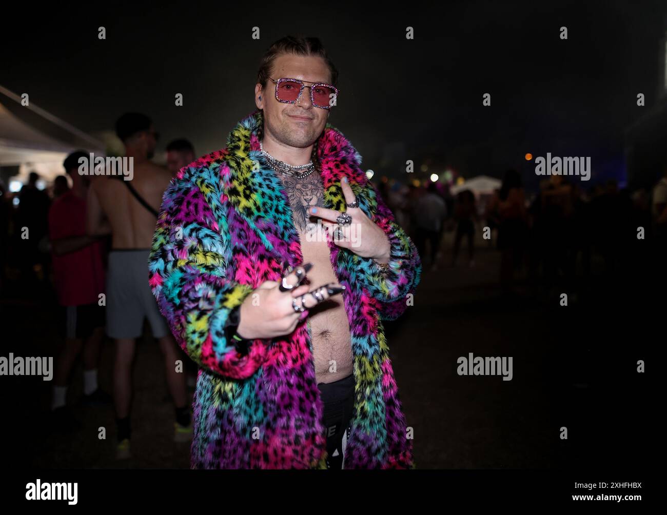 Revellers pose to photographer during second day of Ultra Europe Music ...