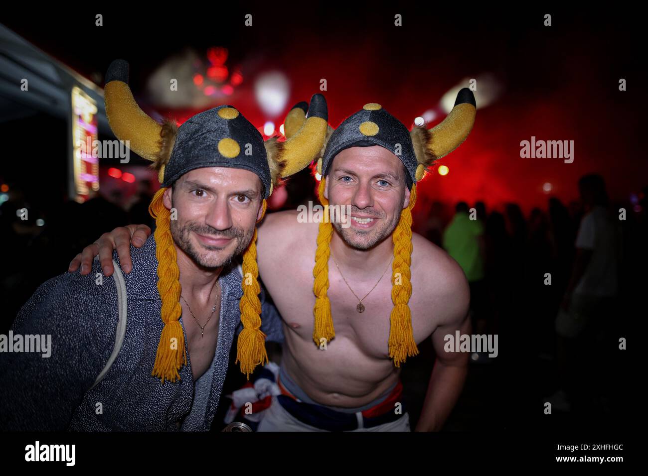 Split, Croatia. 14th July, 2024. Revellers pose to photographer during ...