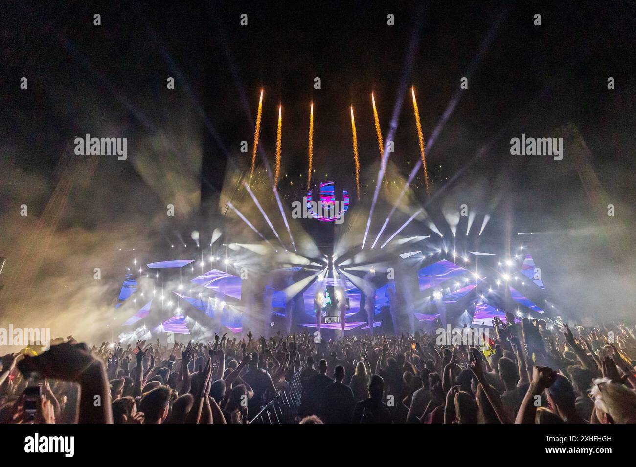 Split, Croatia. 14th July, 2024. Revellers dance as DJ Martin Garrix ...