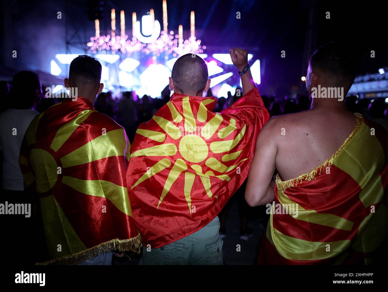 Split, Croatia. 14th July, 2024. Revellers pose to photographer during ...