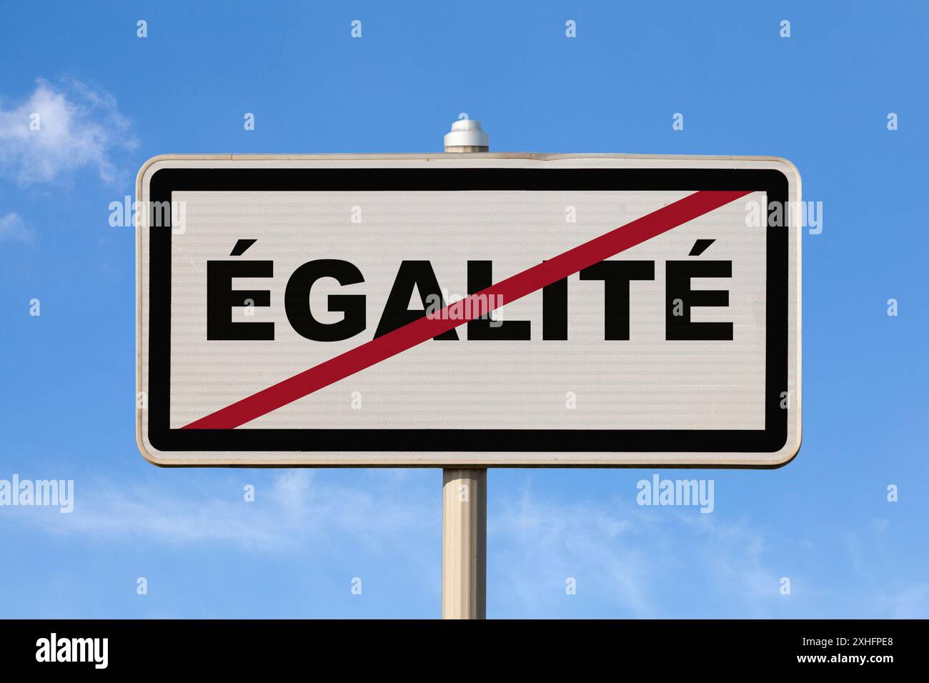 A French exit city sign against a blue sky with written in the middle ...