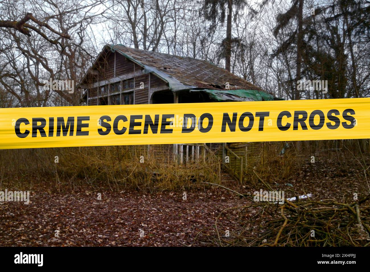 Abandoned cabin in the woods with a police tape with written in it ...