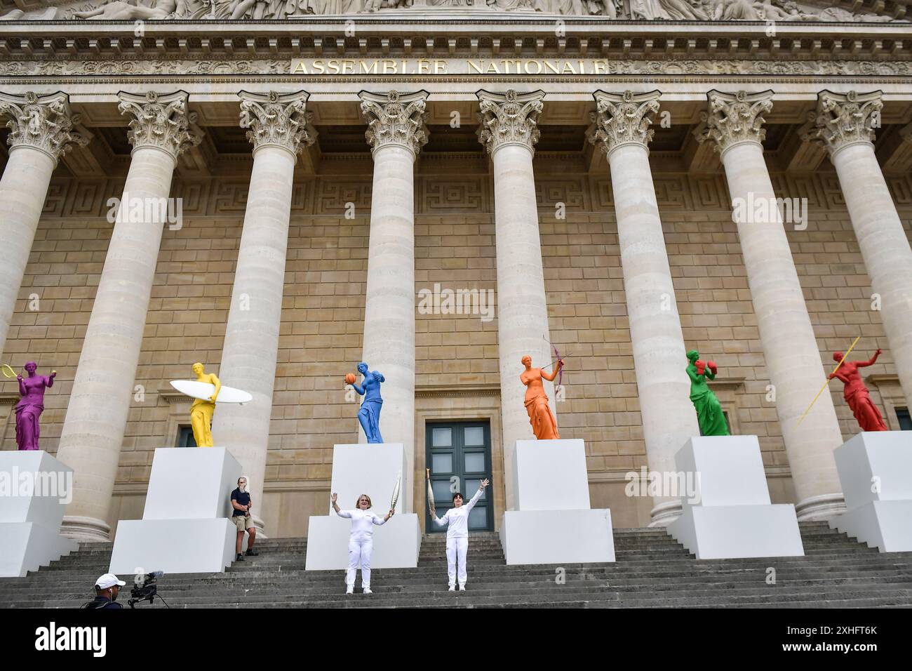 Paris, France. 14th July, 2024. Valerie Frehaut relays the Olympic ...