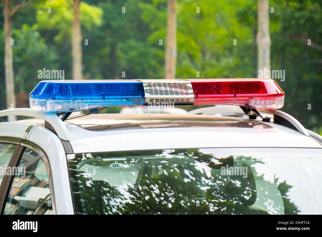Police lights on car during traffic surveillance on the city road ...