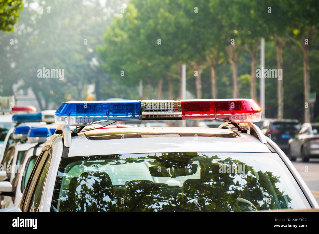 Police lights on car during traffic surveillance on the city road ...