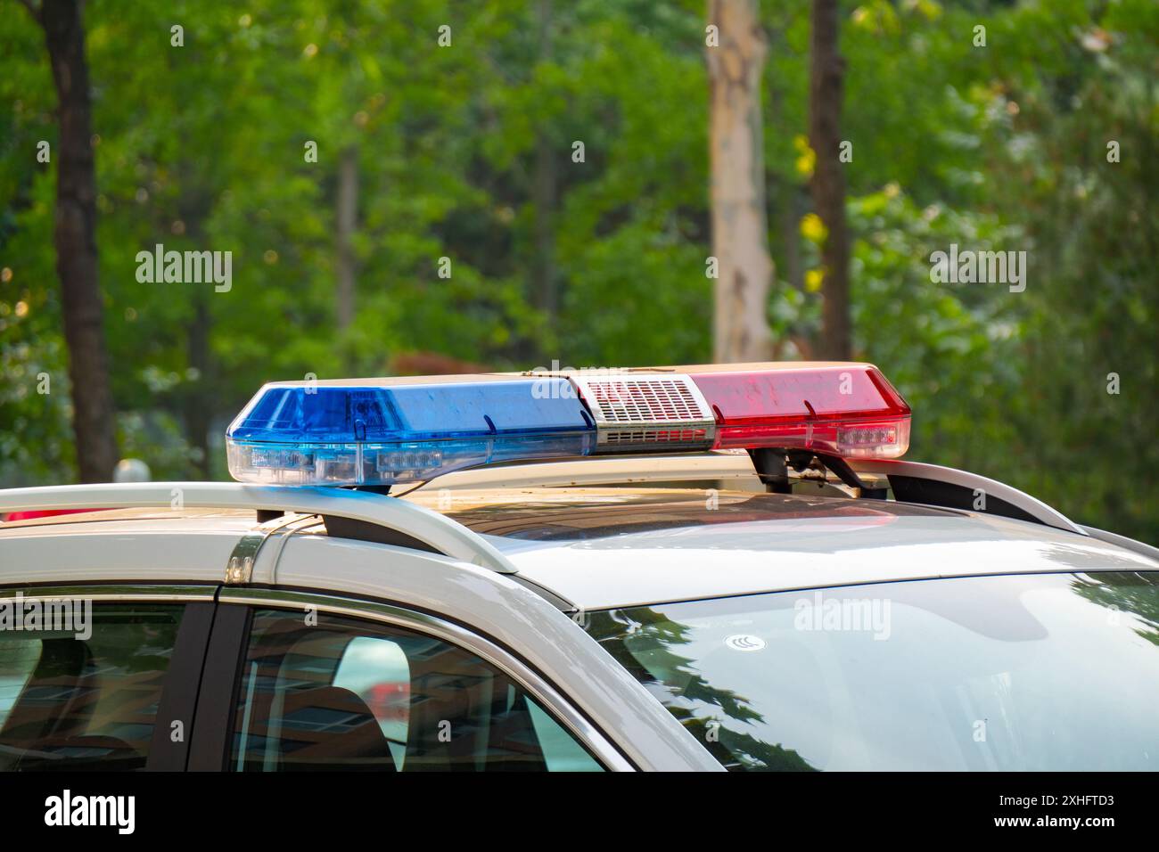 Police lights on car during traffic surveillance on the city road ...