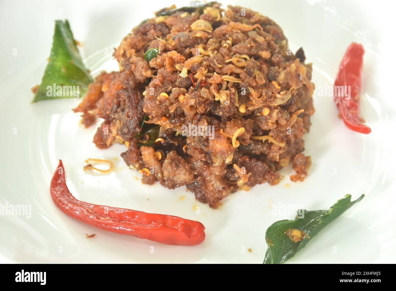 spicy fried chop fermenting fish with herb and chili on plate Stock ...
