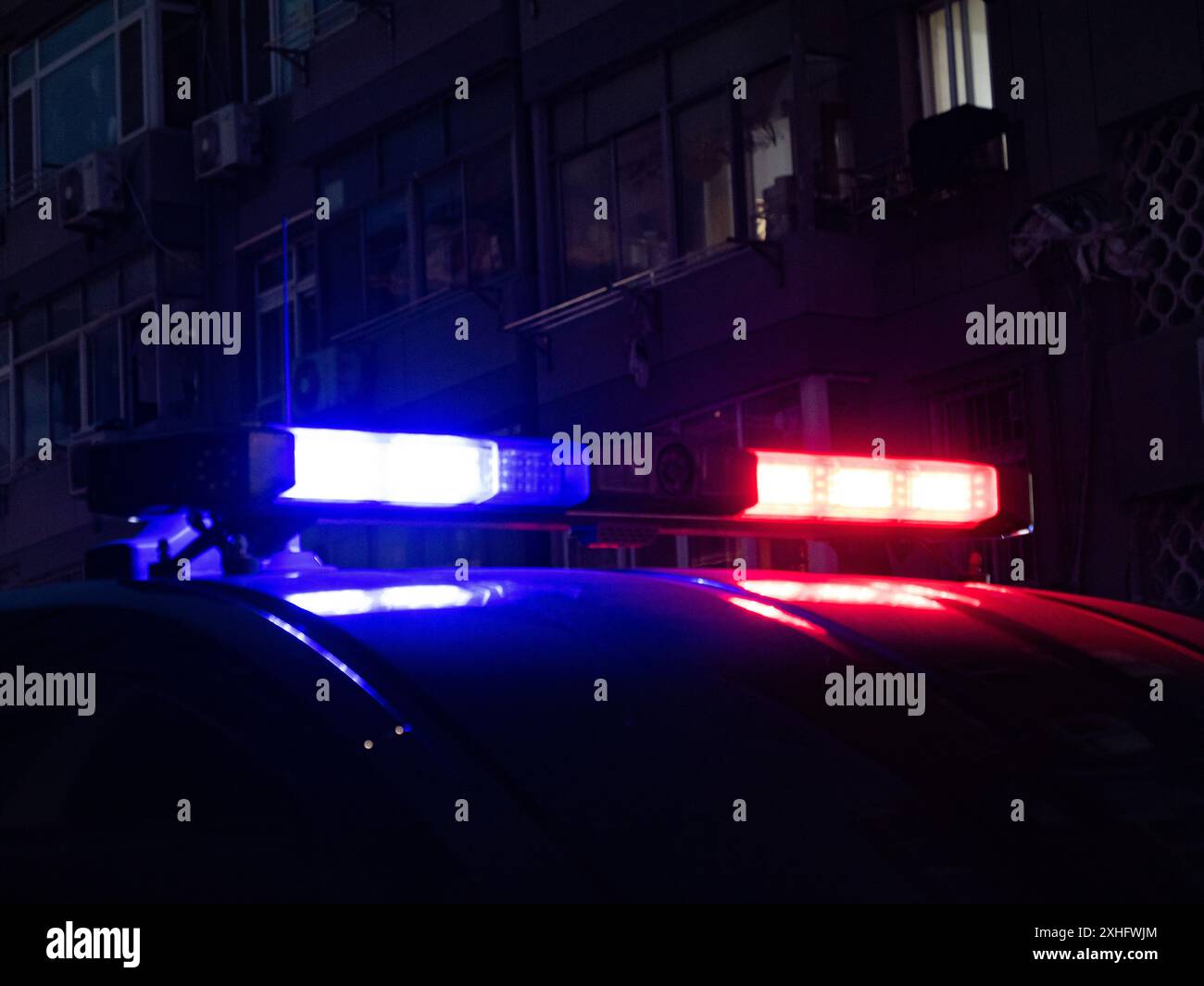 Police lights on car during traffic surveillance on the city road ...