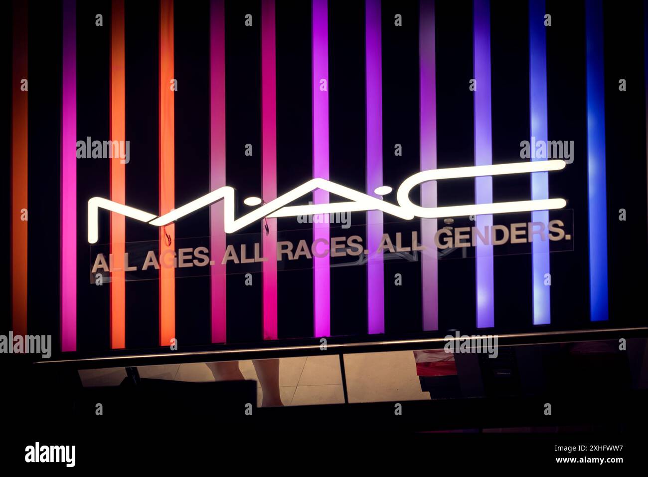 Bright MAC store window with colorful lights displays inclusive message ...