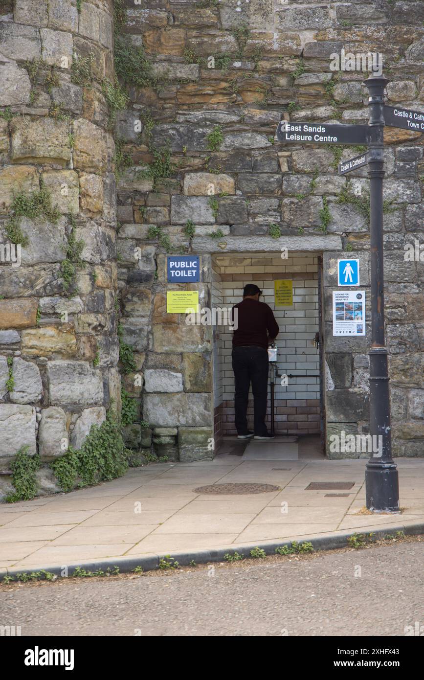 Public toilet WC in the historic city wall next to the medieval gate in ...