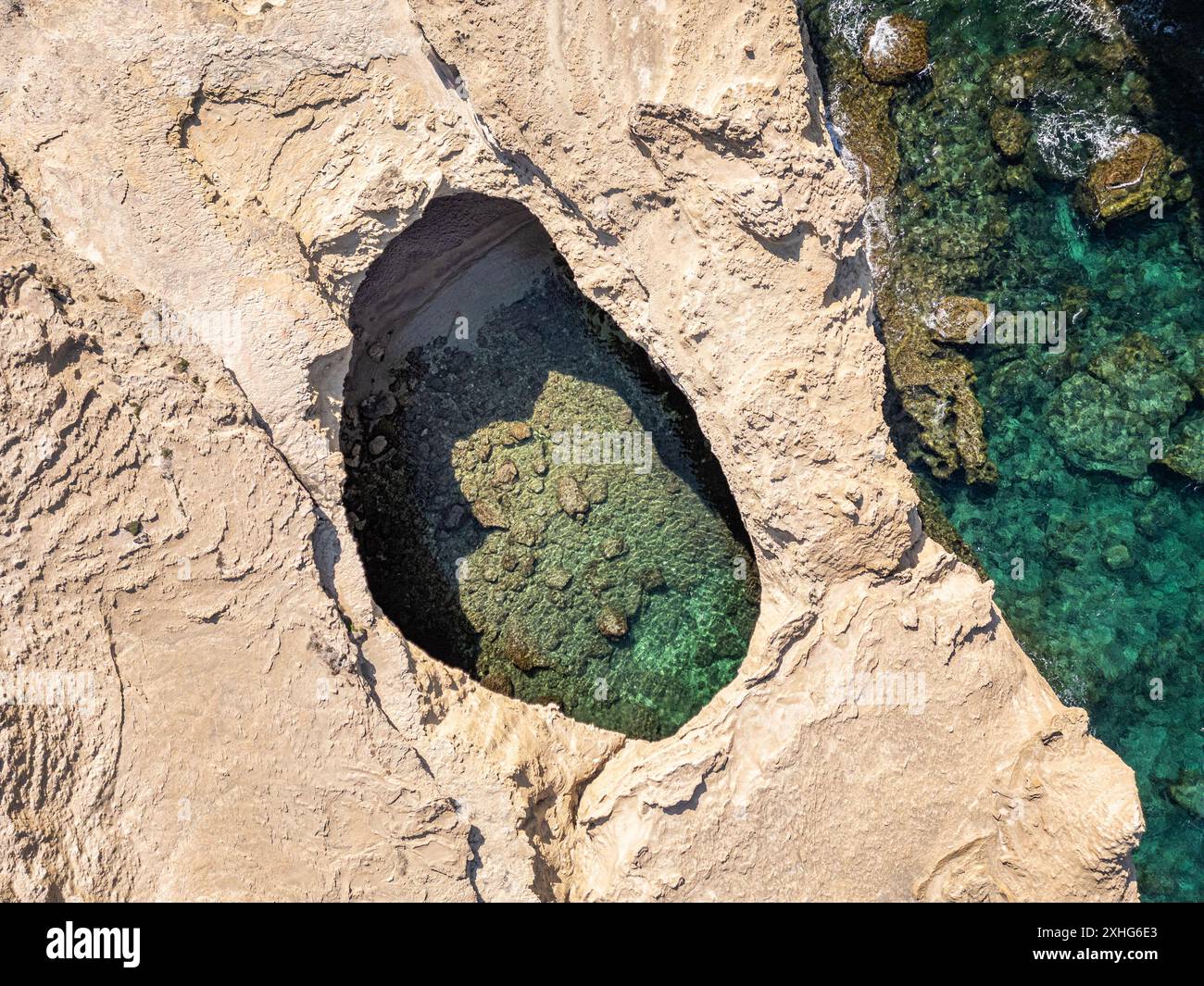 Aerial view of Grotte de Saint Antoine, a collapsed limestone cave on ...