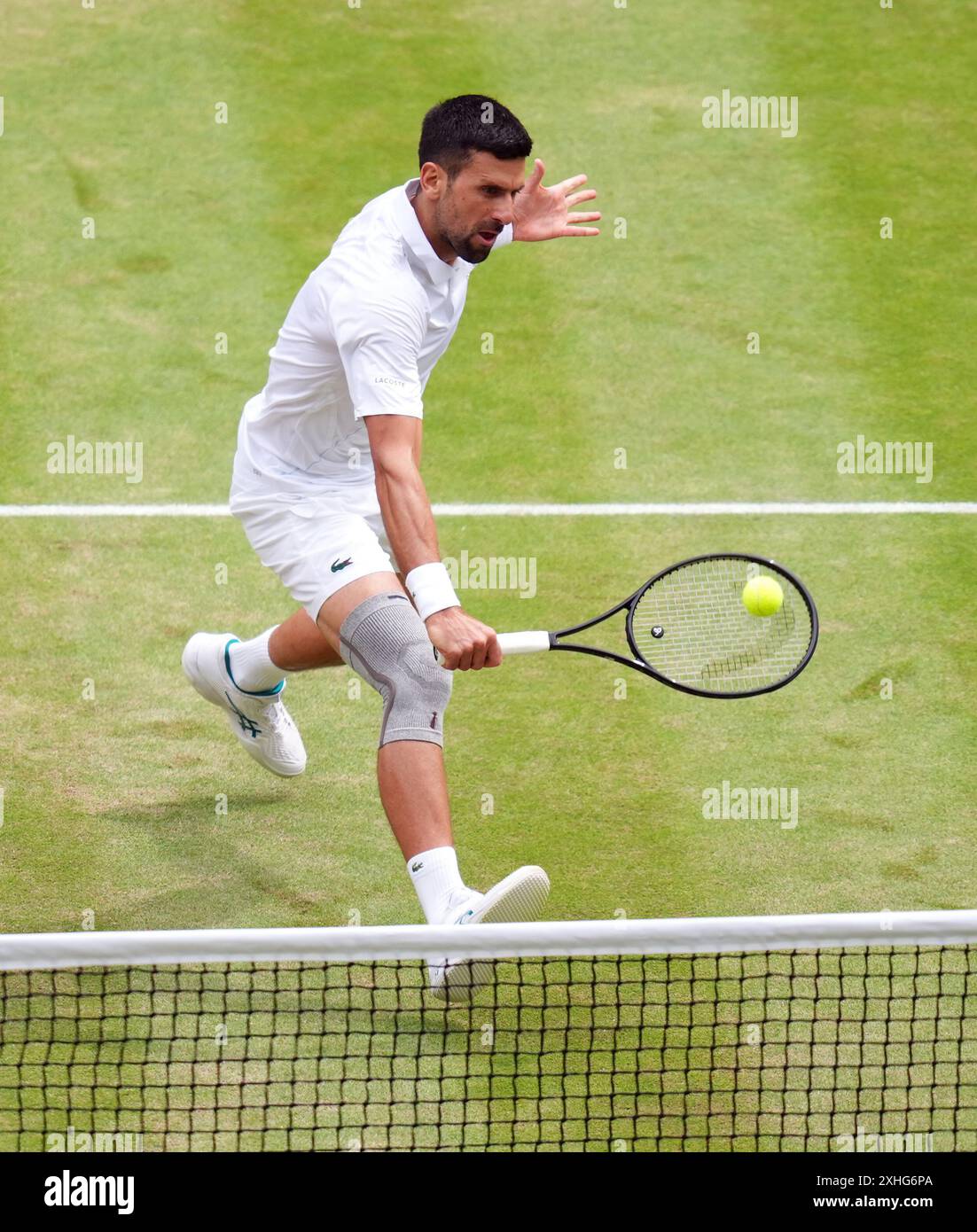 Novak Djokovic in action against Carlos Alcaraz in the Gentlemen's Singles final on day fourteen ...